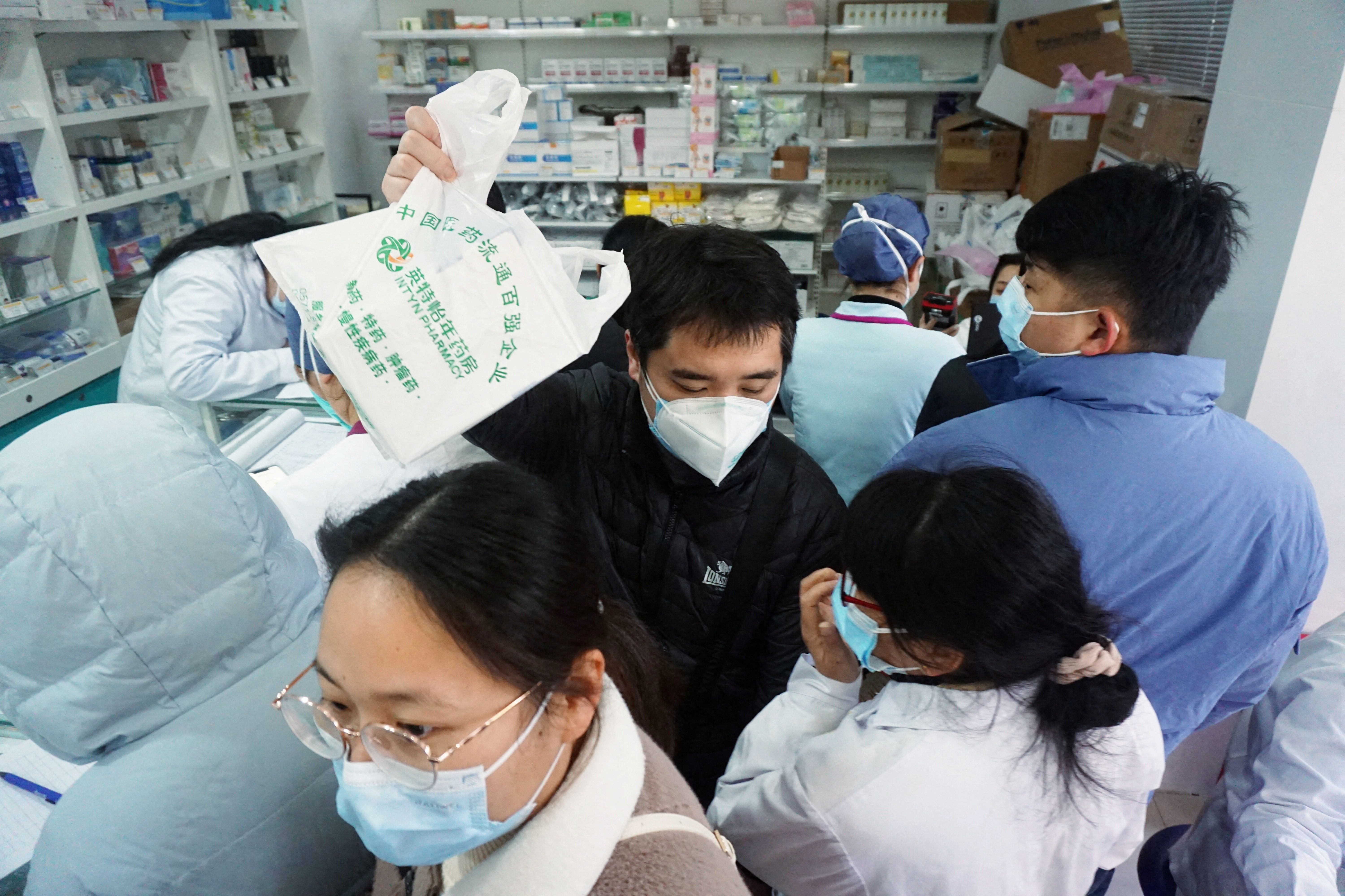 Chinese residents raid pharmacy giving out free meds during drug ...